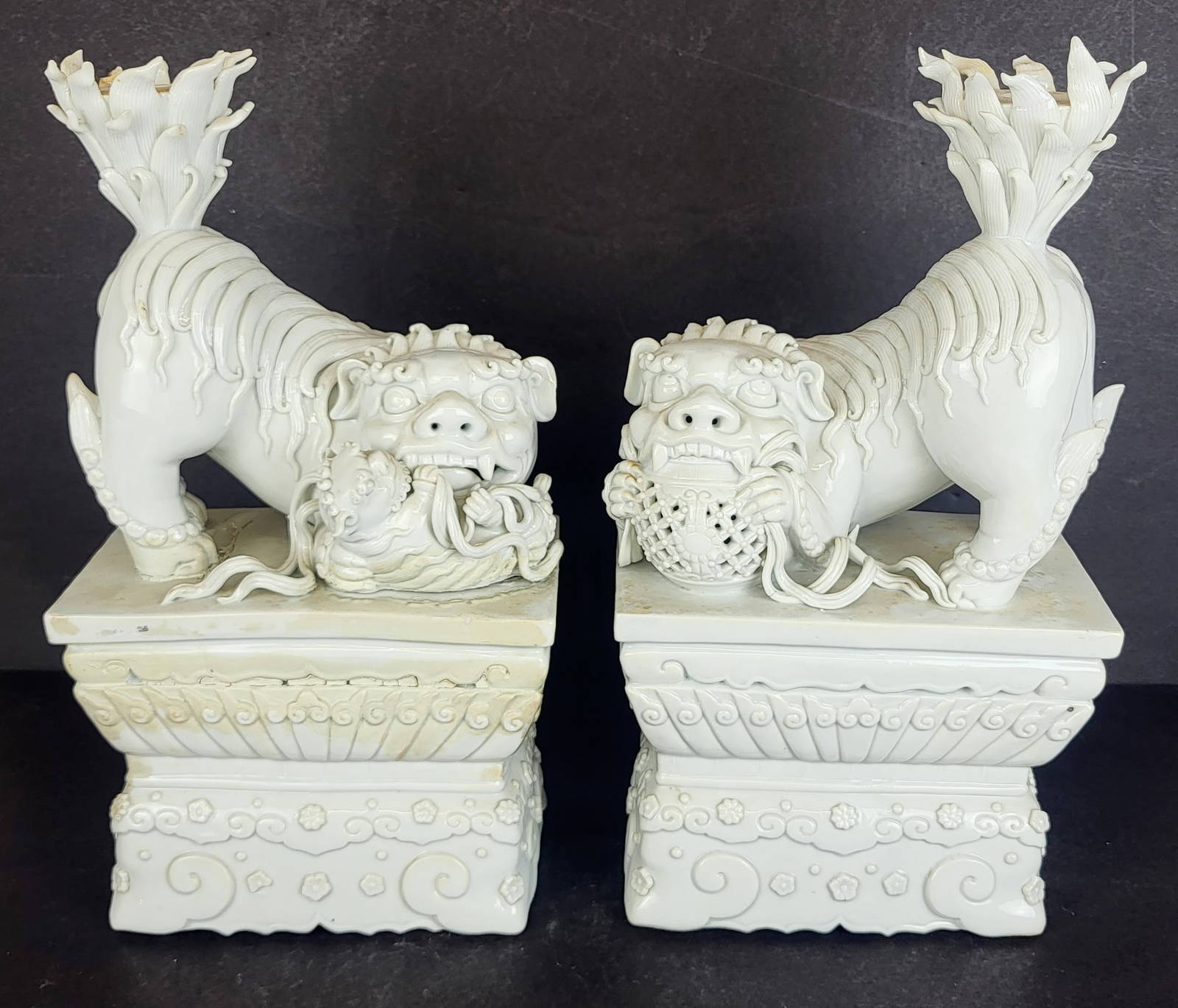 Two Chinese Blanc De Chine Foo Dog Candlesticks Auction