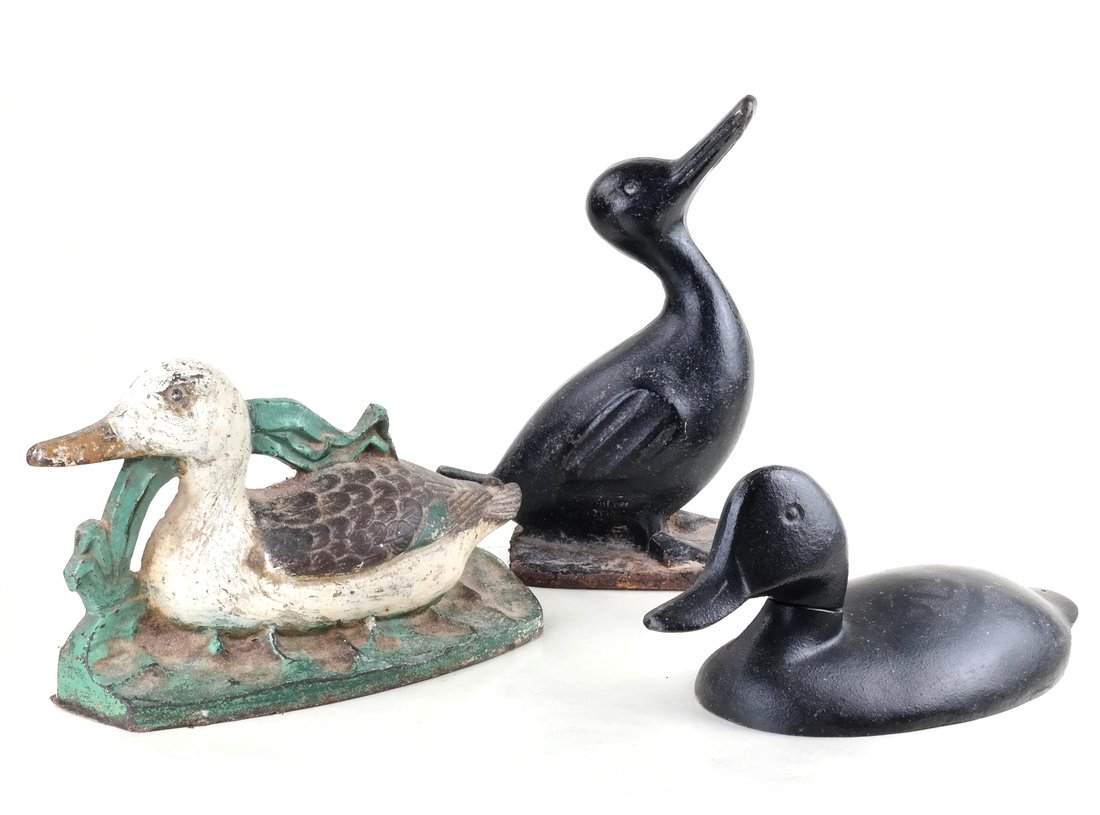 Three Painted Cast Iron Ducks