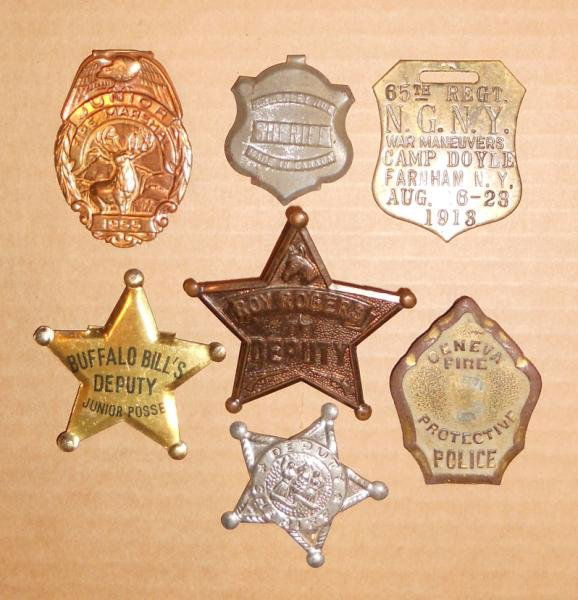 SEVEN COLLECTABLE LAW BADGES