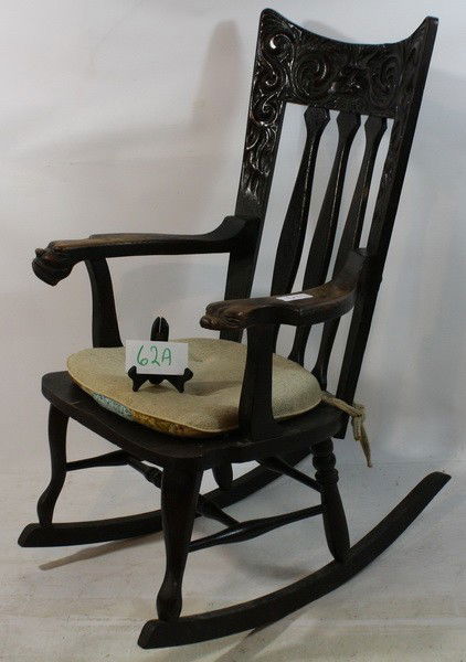 62A: Carved Oak rocking chair with Northwind Face and S