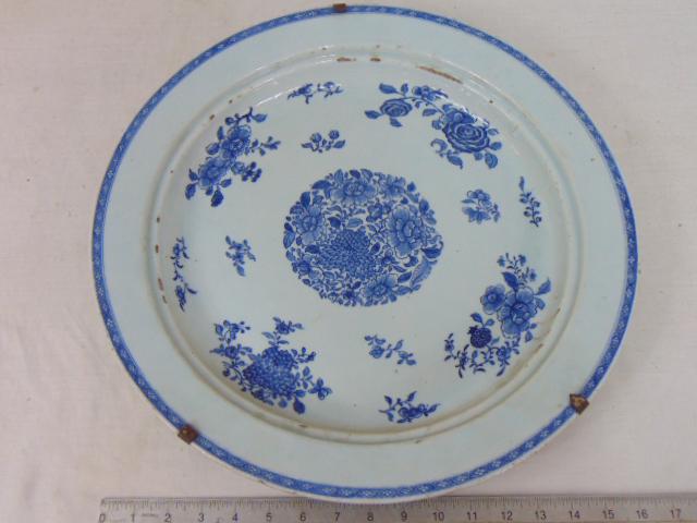 Chinese Delft charger, glazed with blue floral decoration, platter is ...