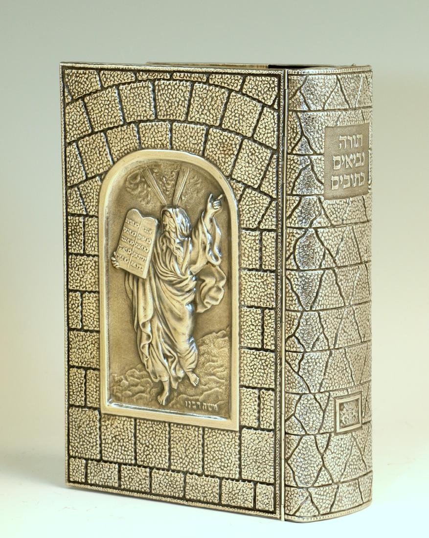 A LARGE STERLING SILVER COVERED BIBLE BY LANDAU.