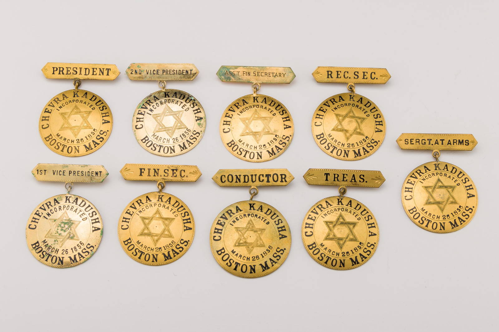 A Group Of Nine Badges From The Boston Chevra Kadusha Auction
