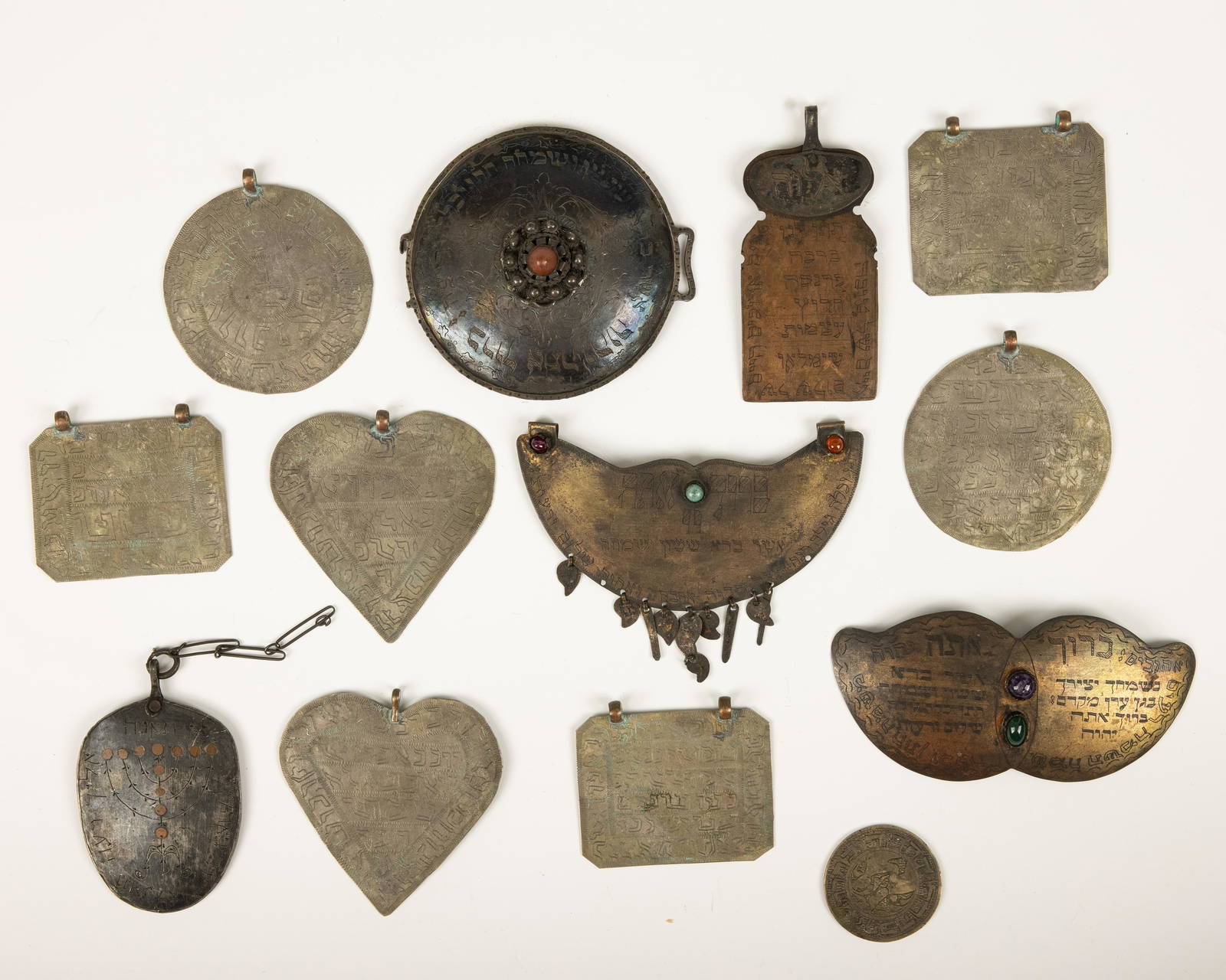 A Collection Of 13 Silver And Other Metal Amulets Auction