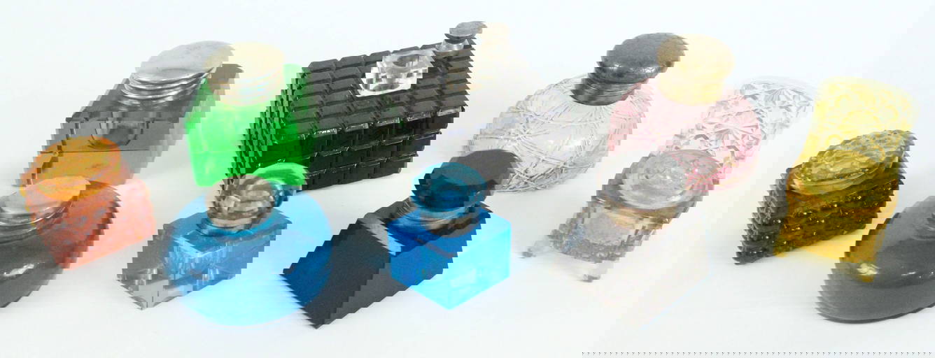 Eight Glass Inkwells In Various Colors