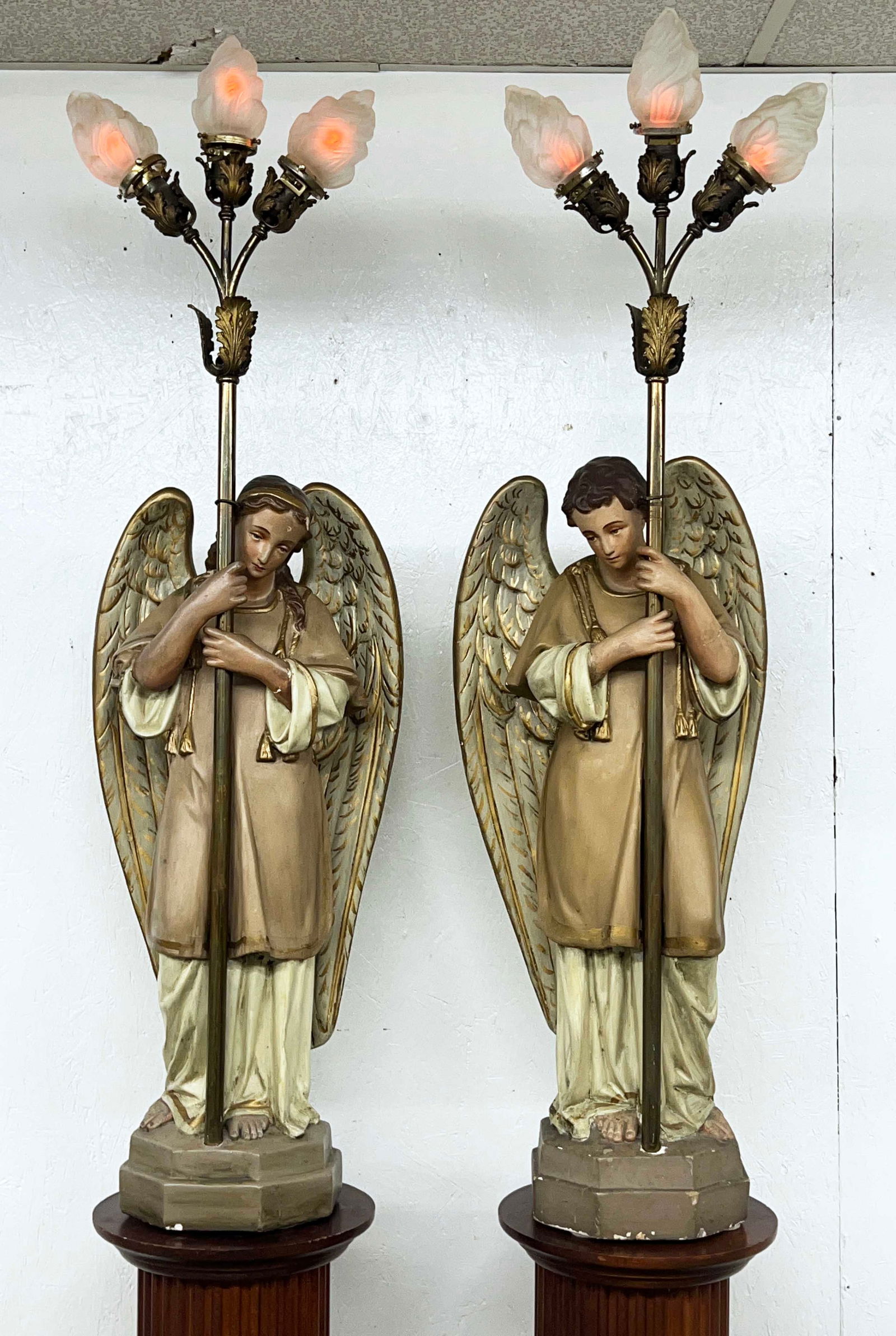 Pair Of Cathedral Angel Lights On Stands Auction