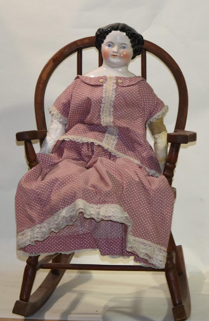 Porcelain Doll with Rocking Chair