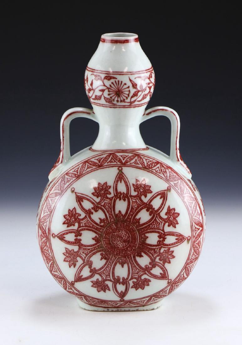 A CHINESE ANTIQUE UNDERGLAZED RED PORCELAIN MOON FLASK