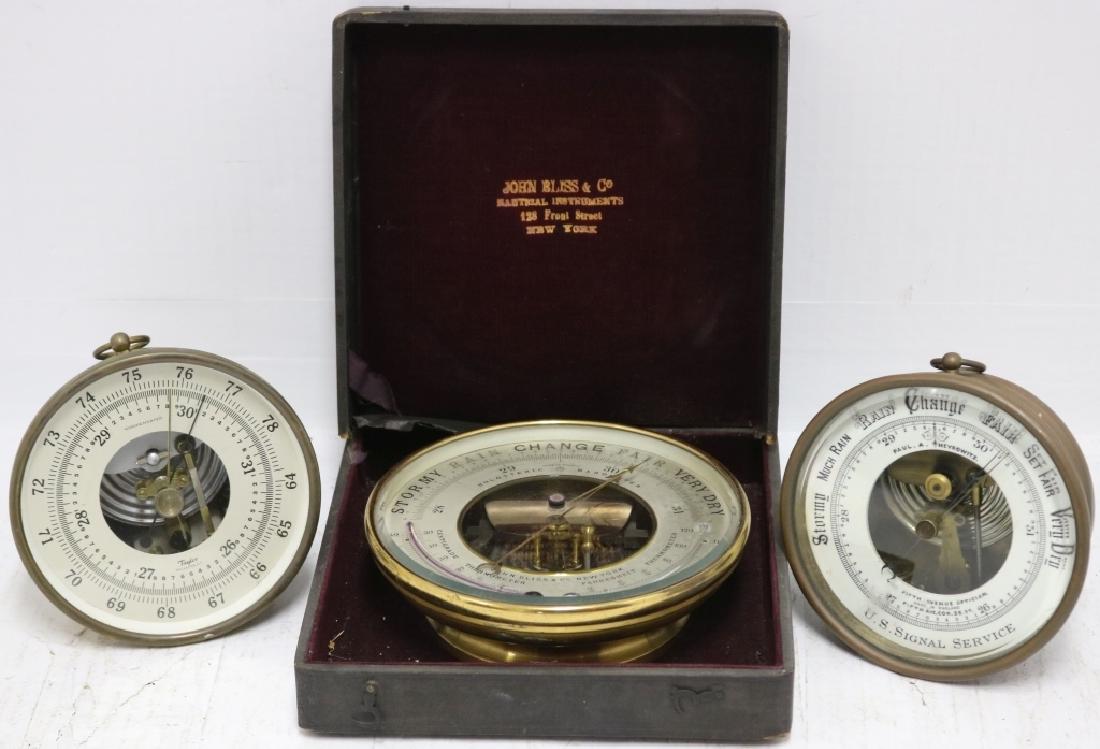 3 ROUND BRASS BAROMETERS. 1 MARKED TAYLOR,