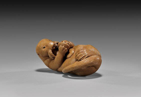 Carved Wood Netsuke: Otter Eating