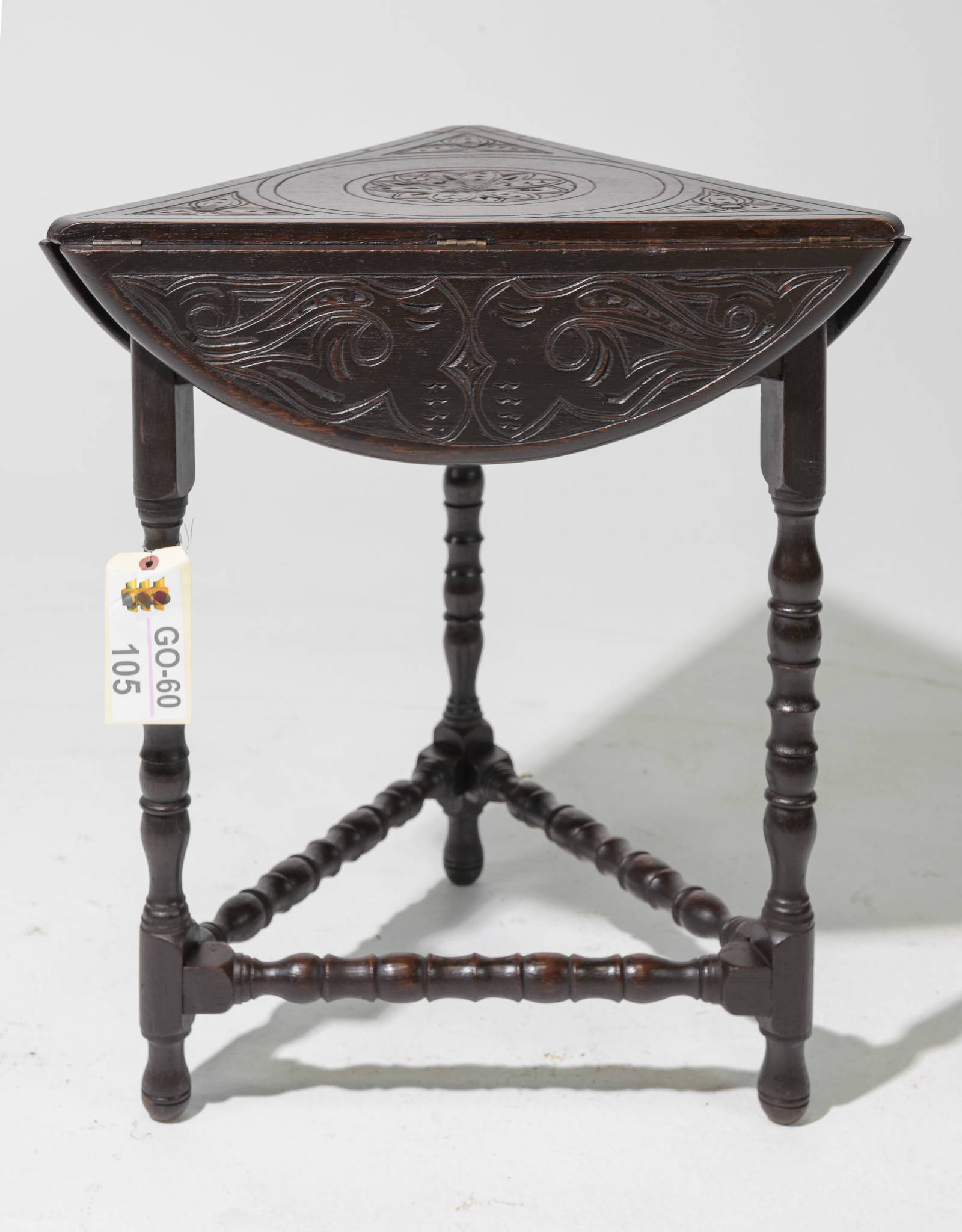 British Finely Carved Oak Drop Sided Triangular Table Auction