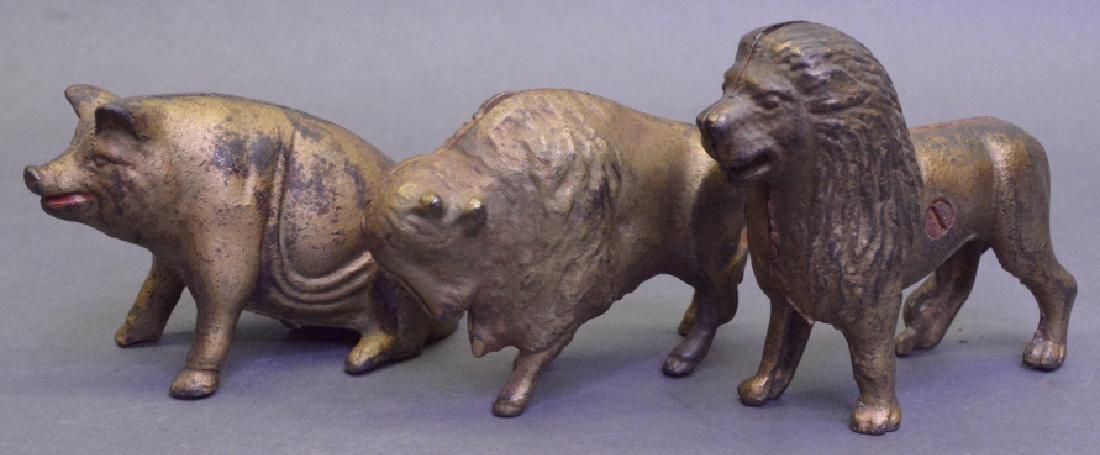 Lot Of Two Cast Iron Banks Lion, Bison And Pig