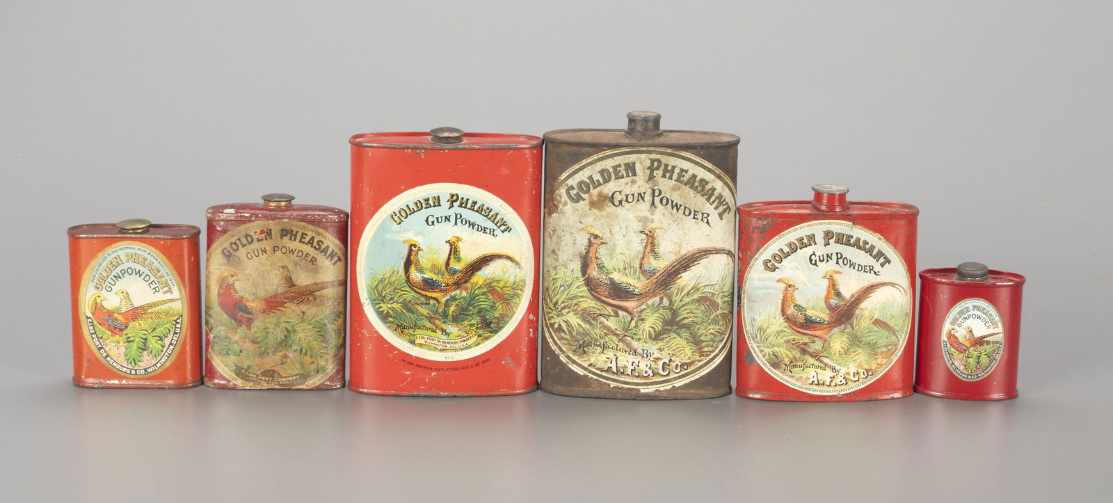 Six Powder Tins