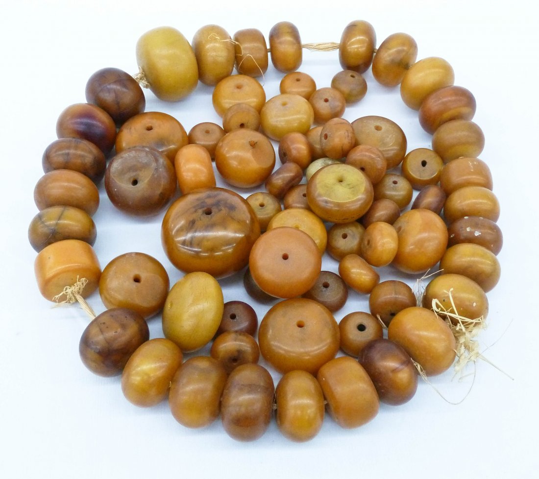 Group of (70) Old Tibetan Copal Amber Beads. Sizes