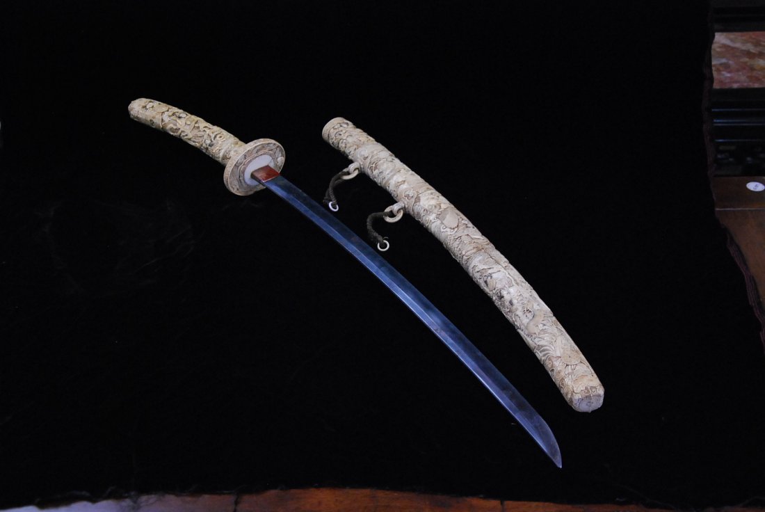 JAPANESE CARVED IVORY SWORD (MEIJI PERIOD, 1868-1912)