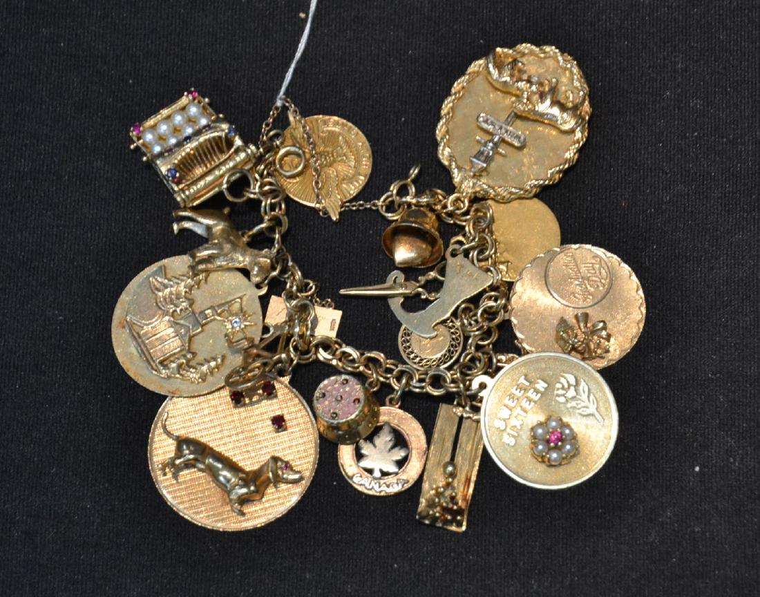 14kt GOLD CHARM BRACELET WITH MANY 14kt CHARMS