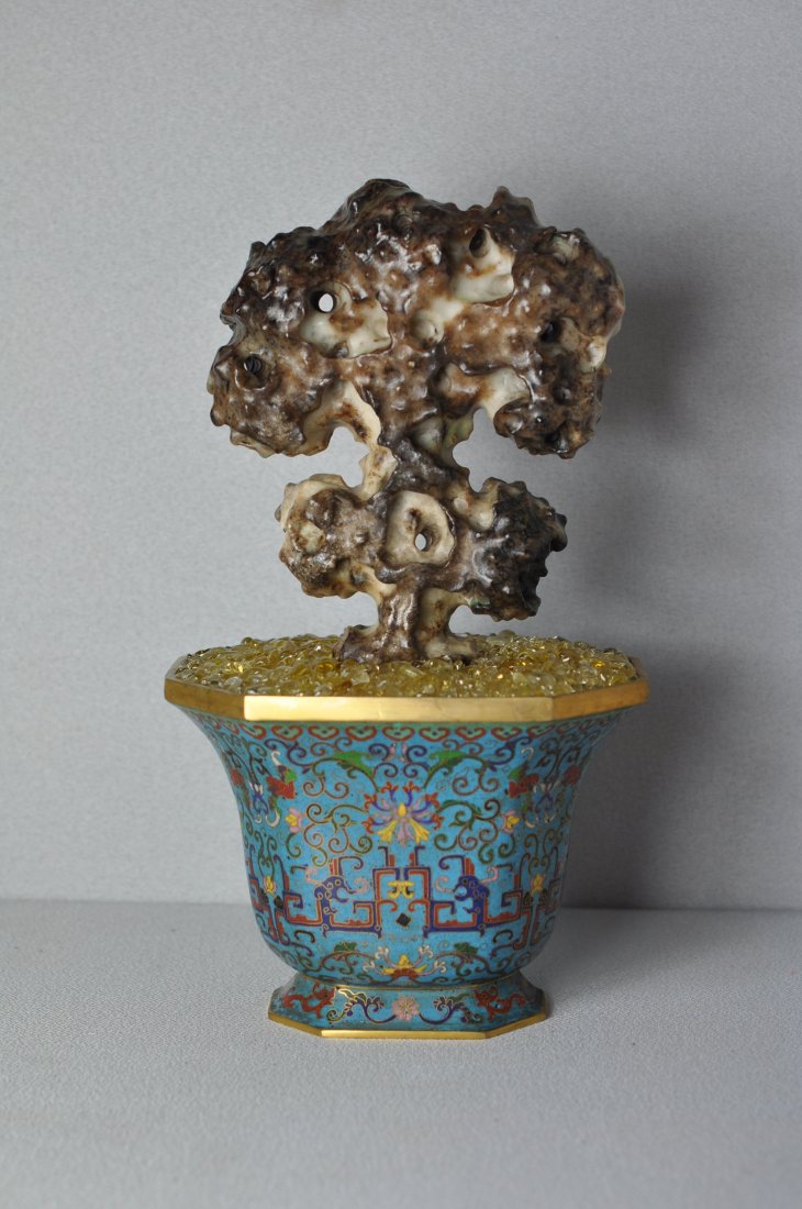 A CHINESE BURNT JADE SCULPTURE