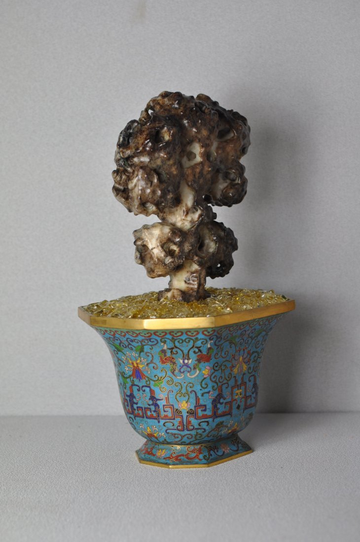 A CHINESE BURNT JADE SCULPTURE