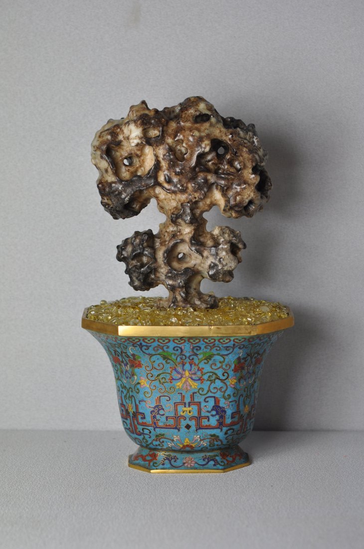 A CHINESE BURNT JADE SCULPTURE