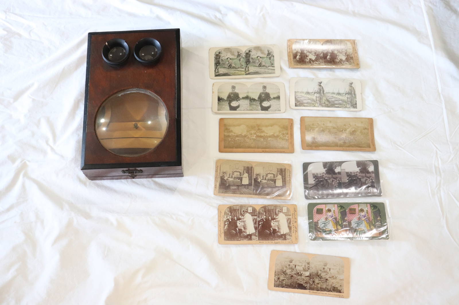 A Stereo Viewer With Cards Auction