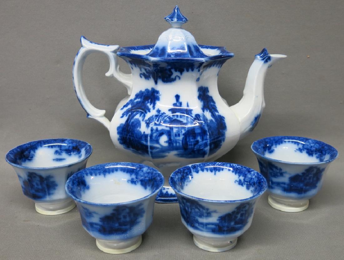 Staffordshire Flow Blue Teapot And Four Cups