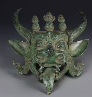 A Tibetan Bronze Chitipati Mask.