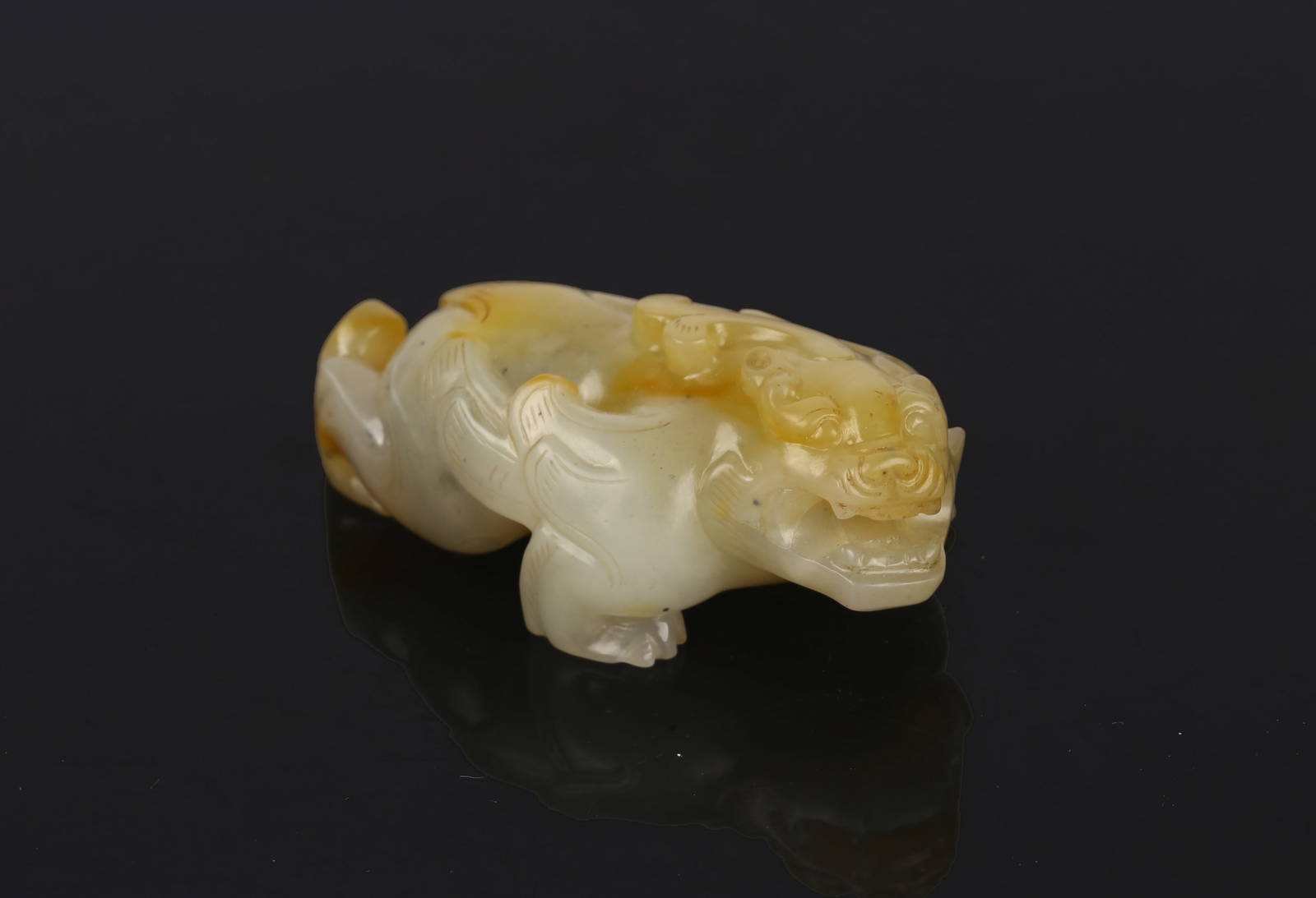 A Chinese White Jade Mythical Beast, Bixie Auction