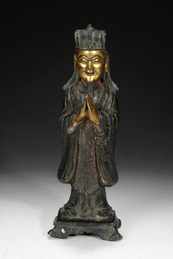 A GILT AND LACQUER BRONZE DAOIST STATUE
