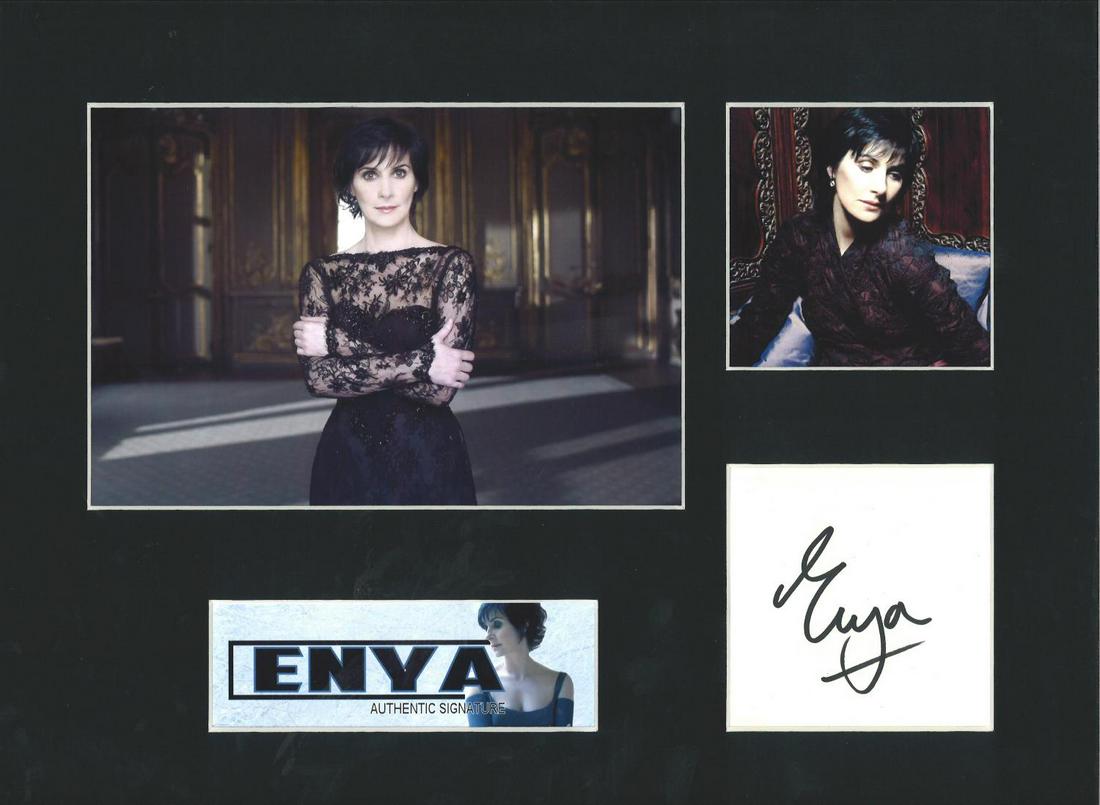 Enya signature piece mounted with 2 pictures. Approx - Aug 09, 2019 ...