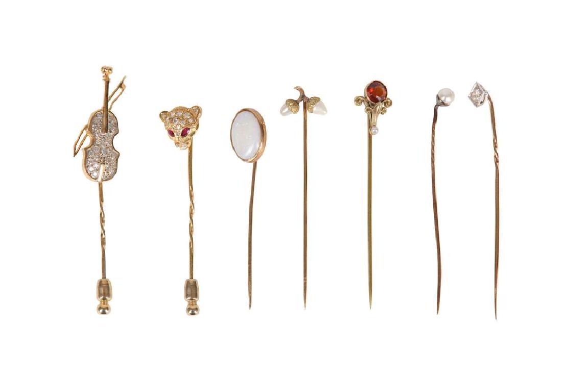 A group of seven gem-set stick pins
