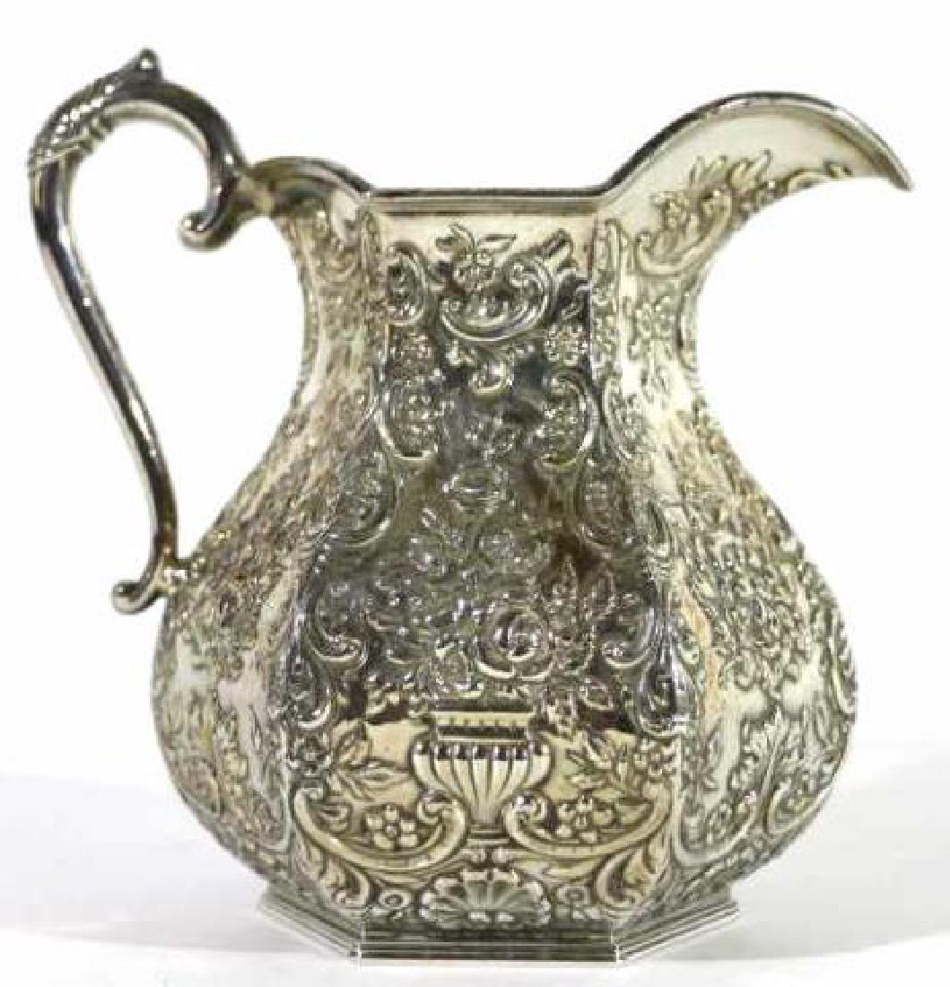 HAND CHASED SILVER PITCHER