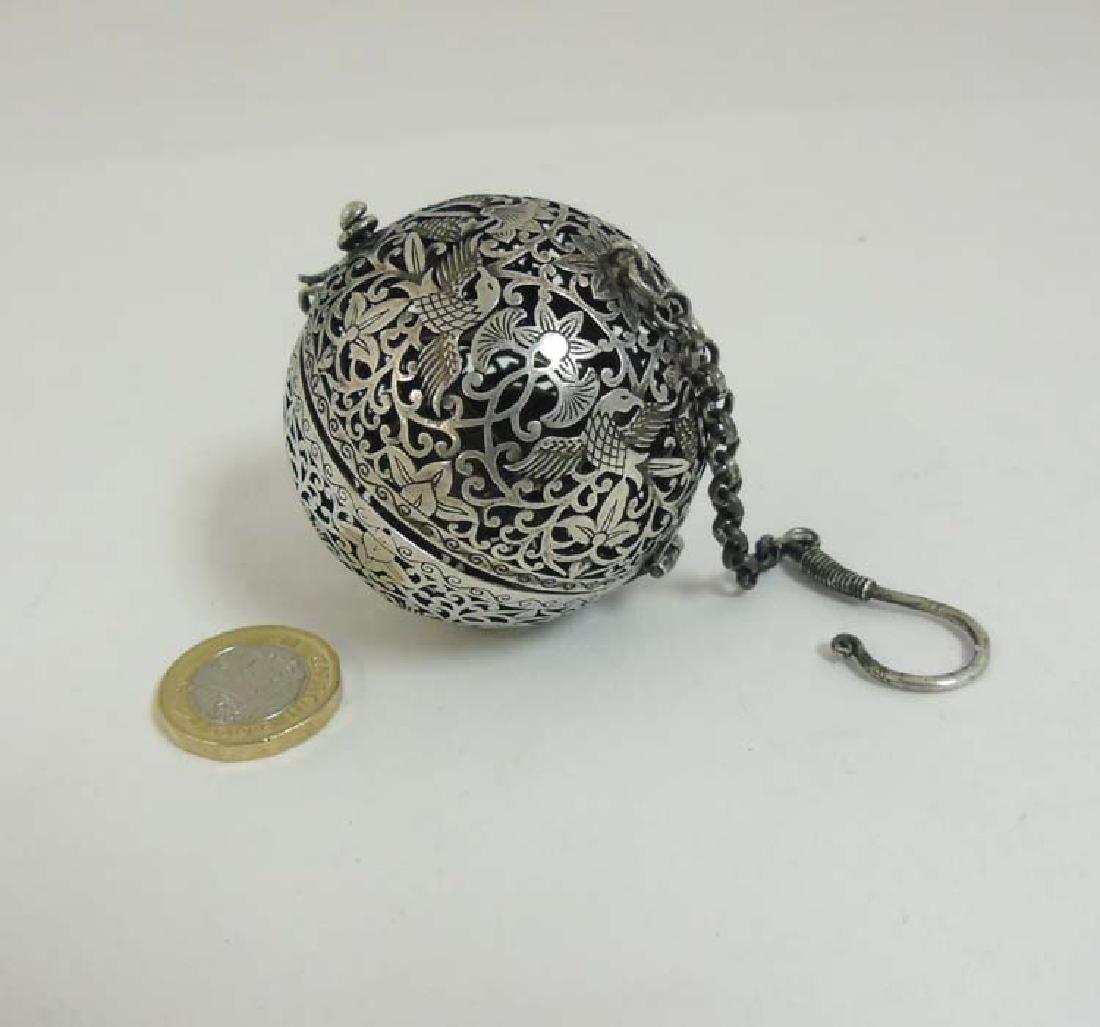 A Chinese White Metal Pomander Of Spherical Form