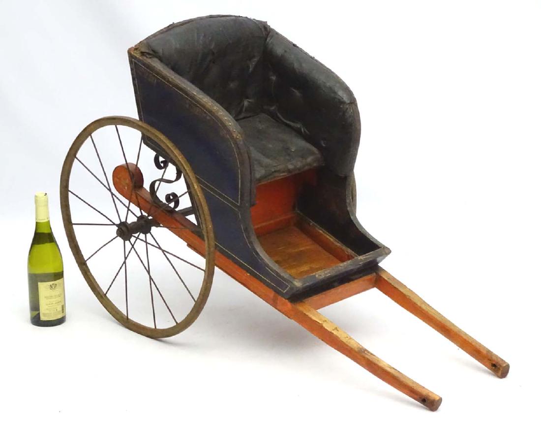 A Victorian Dog Cart with upholstered button back