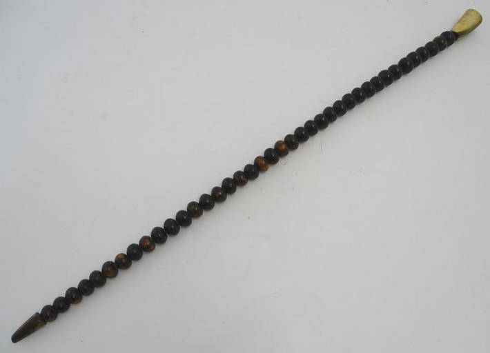 A Walking Cane / Stick Composed Of Threaded Nuts