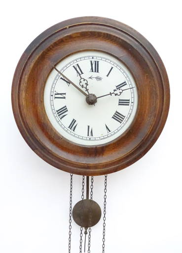 A postmans alarm style wall clock with cast black - Dec 30, 2021 ...