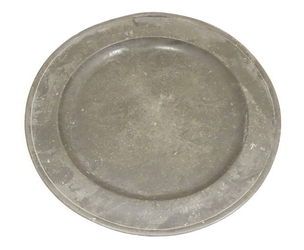 A large 18thC pewter charger plate of circular form, (#1593) on Feb 24 ...