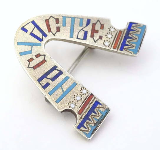 A Russian Silver Brooch With Enamel Detail Formed As A Stylised Rushnyk ...