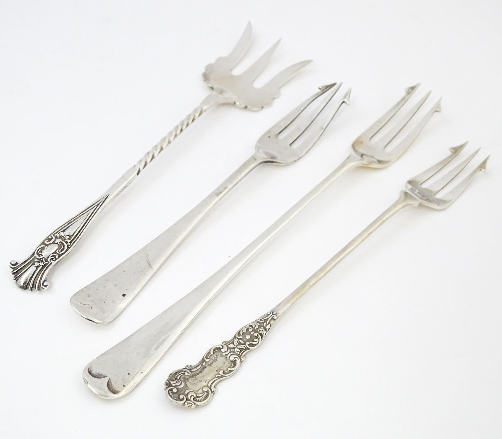 Four Assorted Silver Forks To Include Three Pickle Forks, Hallmarks To ...