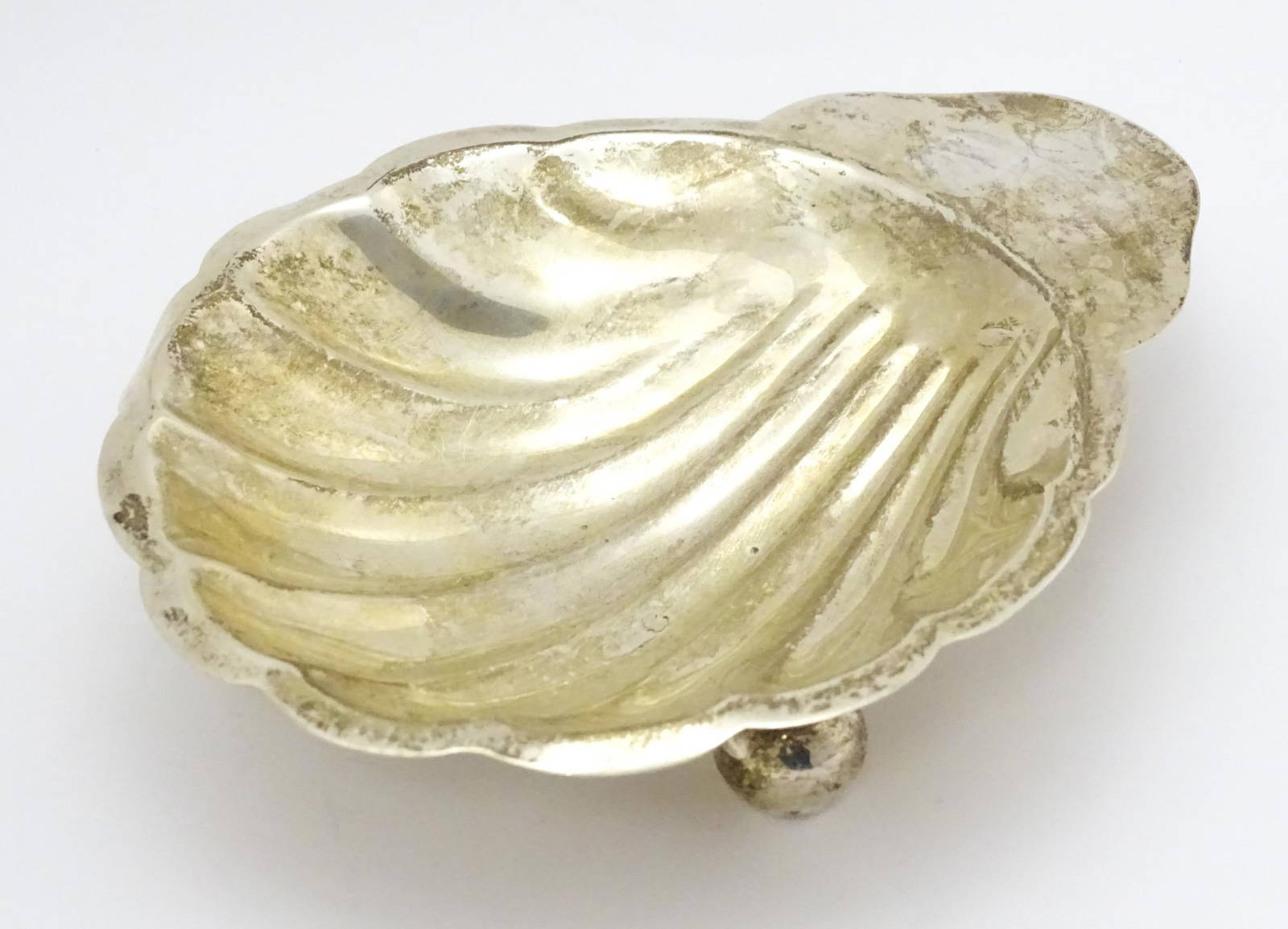 A Mexican Sterling Silver Butter Dish Of Scallop Shell Form Raised On ...