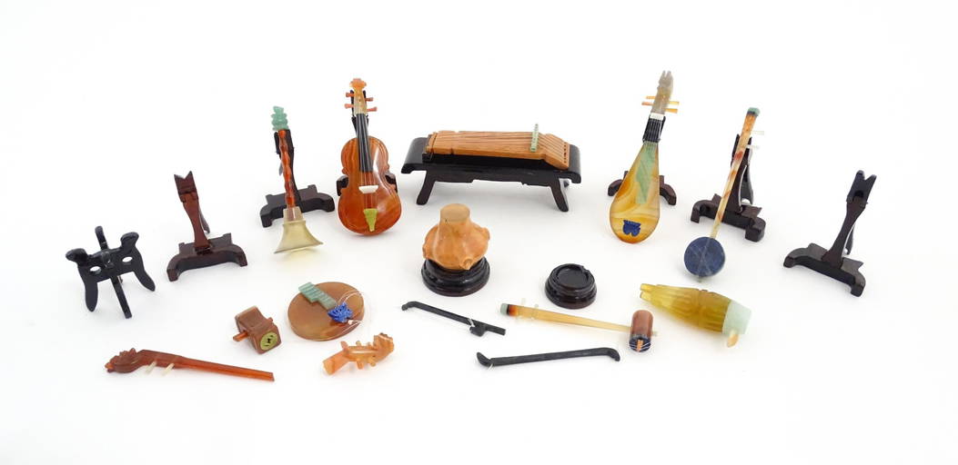 A Quantity Of Oriental Hardstone Models Of Musical Instruments To ...