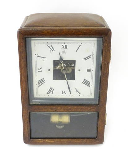 Bulle : A French Art Deco Oak Cased Electric Mantel Clock By Bulle. The ...