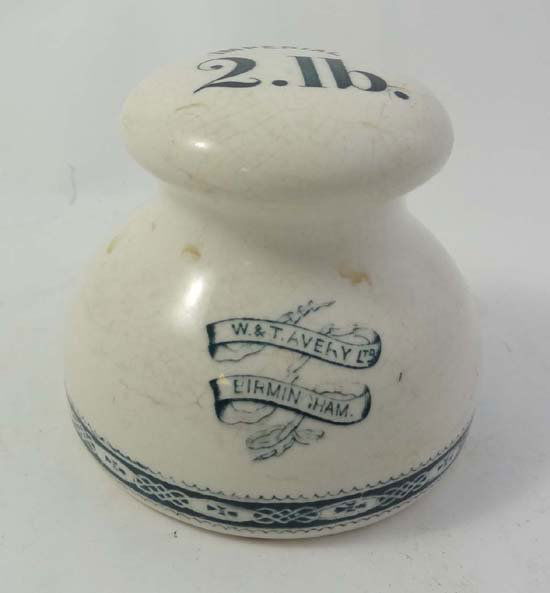 An Imperial 2lb ceramic dumb weight for W & T Avery Ltd