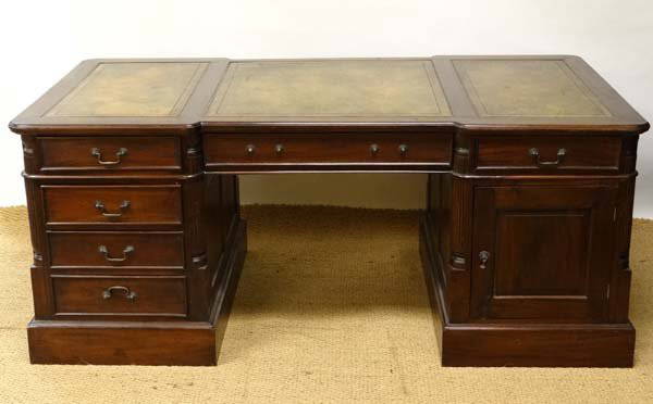 A Contemporary Partners Desk Of Reverse Break Front