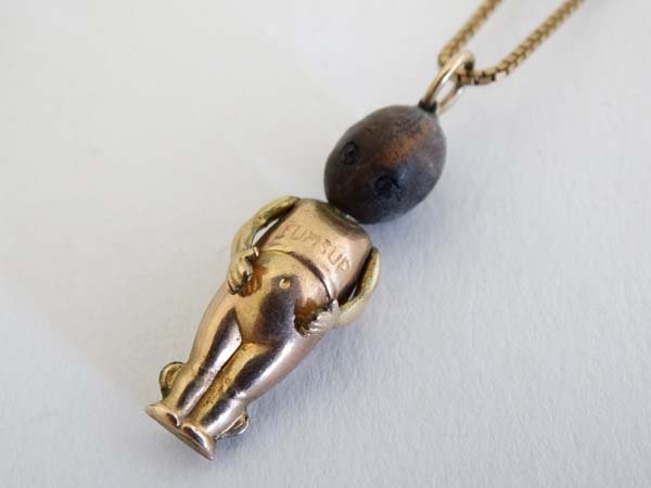 Fumsup Lucky Charm Necklace : A 9ct gold necklace with - May 10, 2014 ...