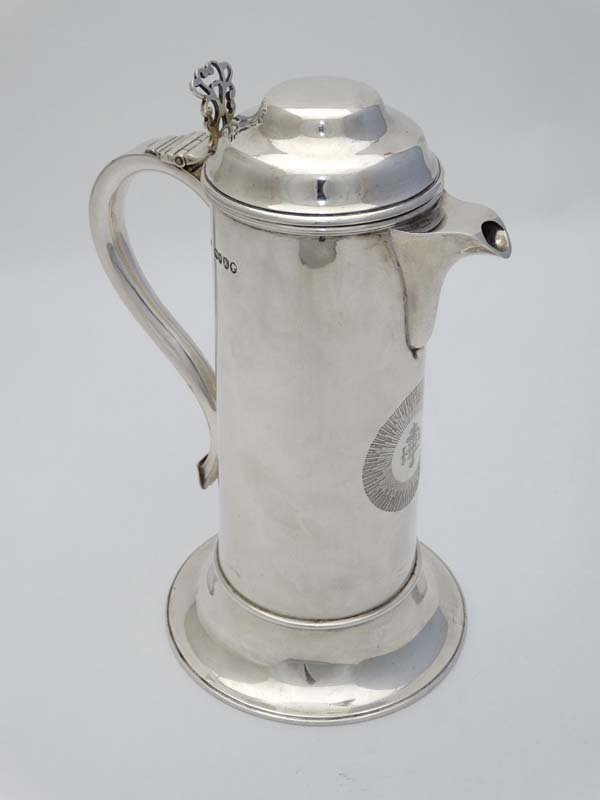A Victorian silver ecclesiastical communion wine flagon