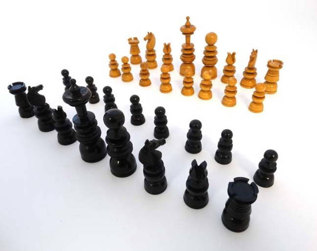 A Turned Wooden Chess Set In A St George Style,