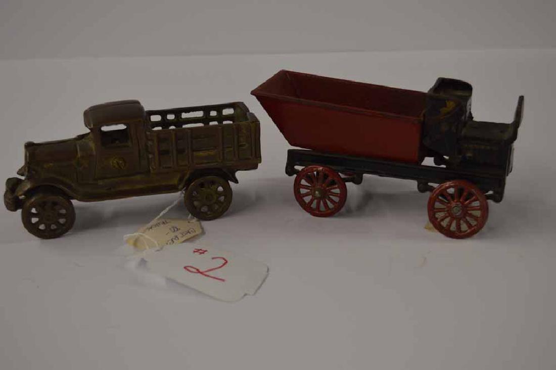 Cast Iron Dump Truck & A Brass Rack Truck