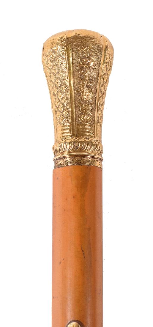 A late 18th century gold and malacca walking stick