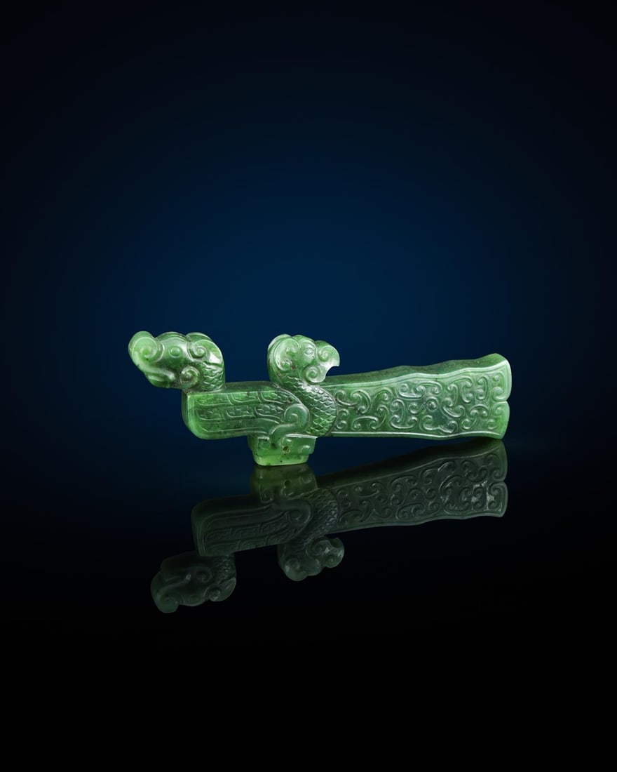 A Chinese Archaistic Spinach Jade Staff Fitting Auction