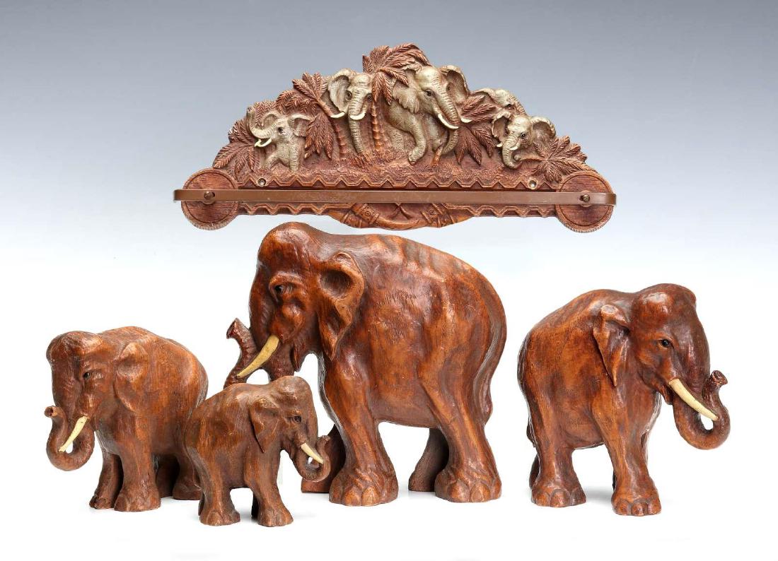 A COLLECTION OF SYROCO ELEPHANT FIGURES AND RACK